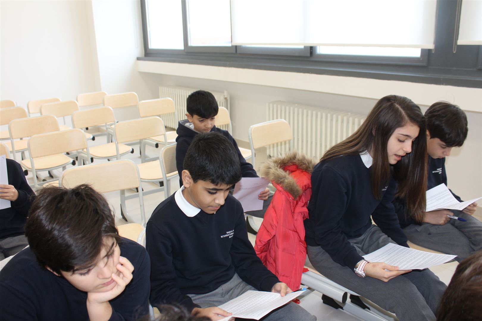 Students reading an unseen piece to the director - SABIS® SUN ...